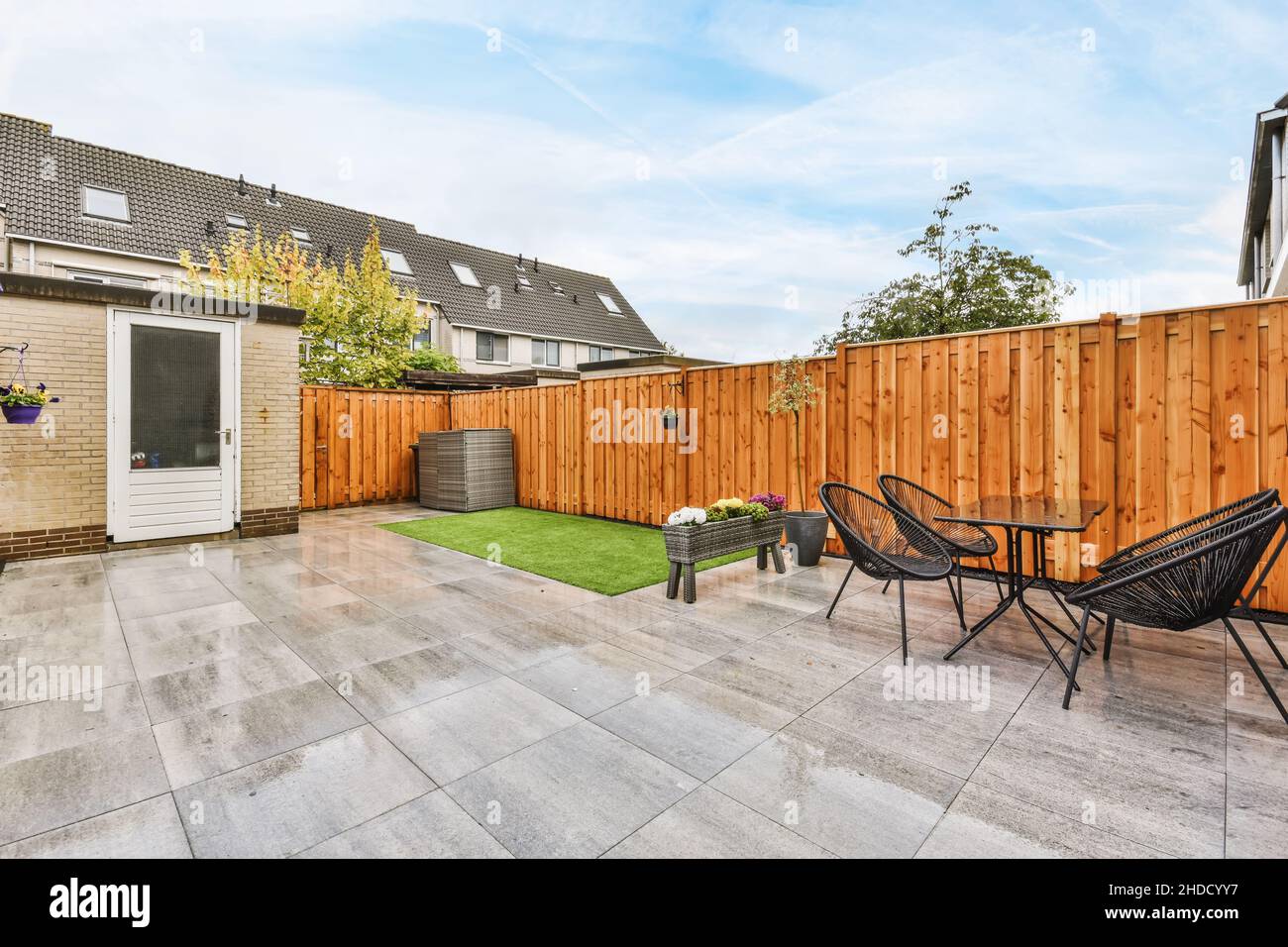 nice courtyard with greenery and a comfortable seating area Stock Photo ...