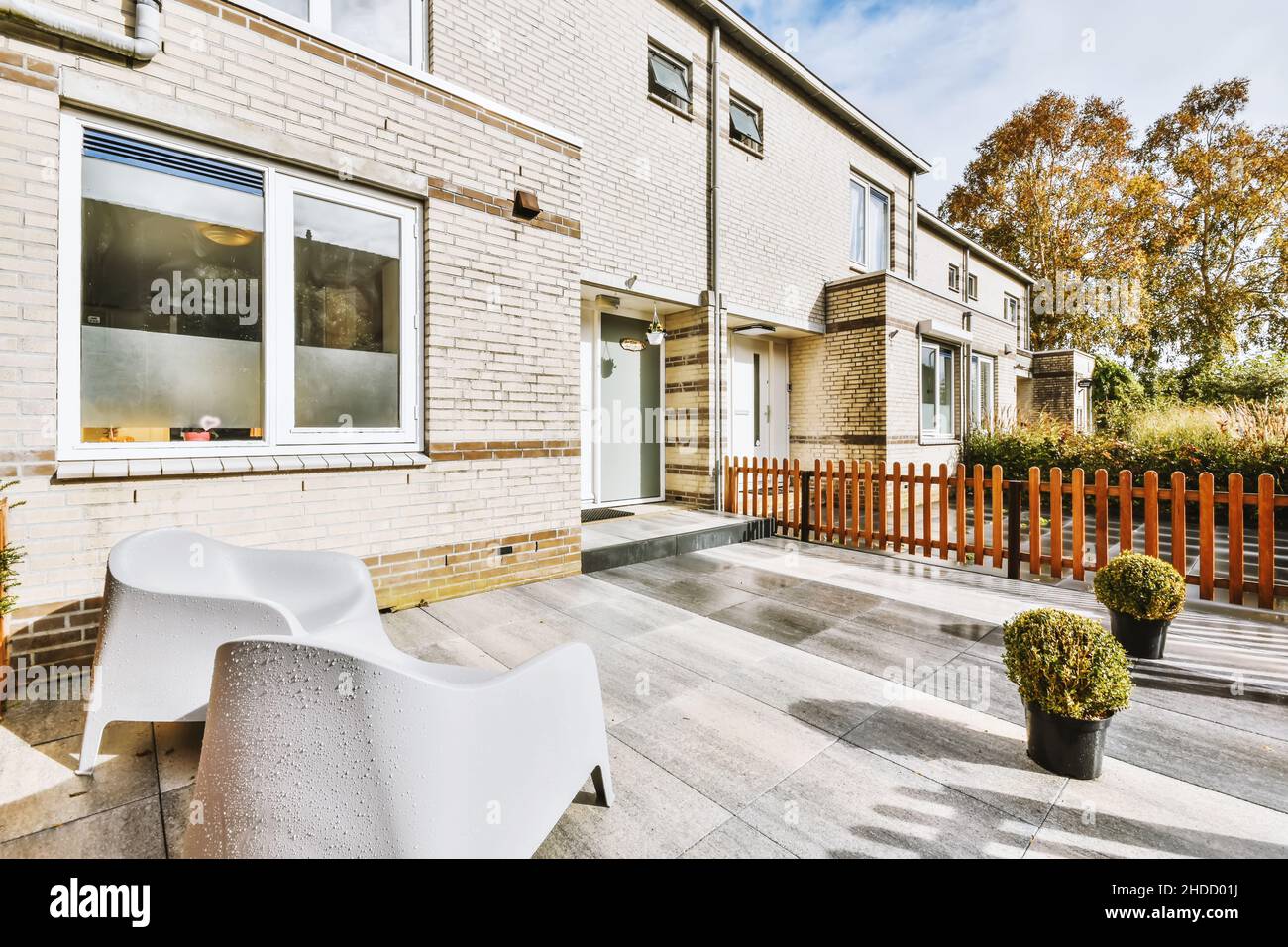 Nice courtyard with greenery and a comfortable seating area Stock Photo ...