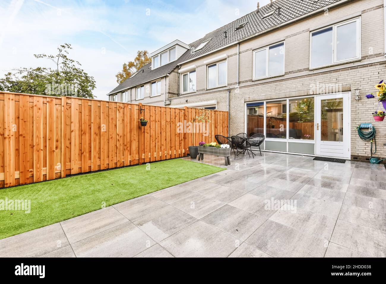 nice courtyard with greenery and a comfortable seating area Stock Photo ...