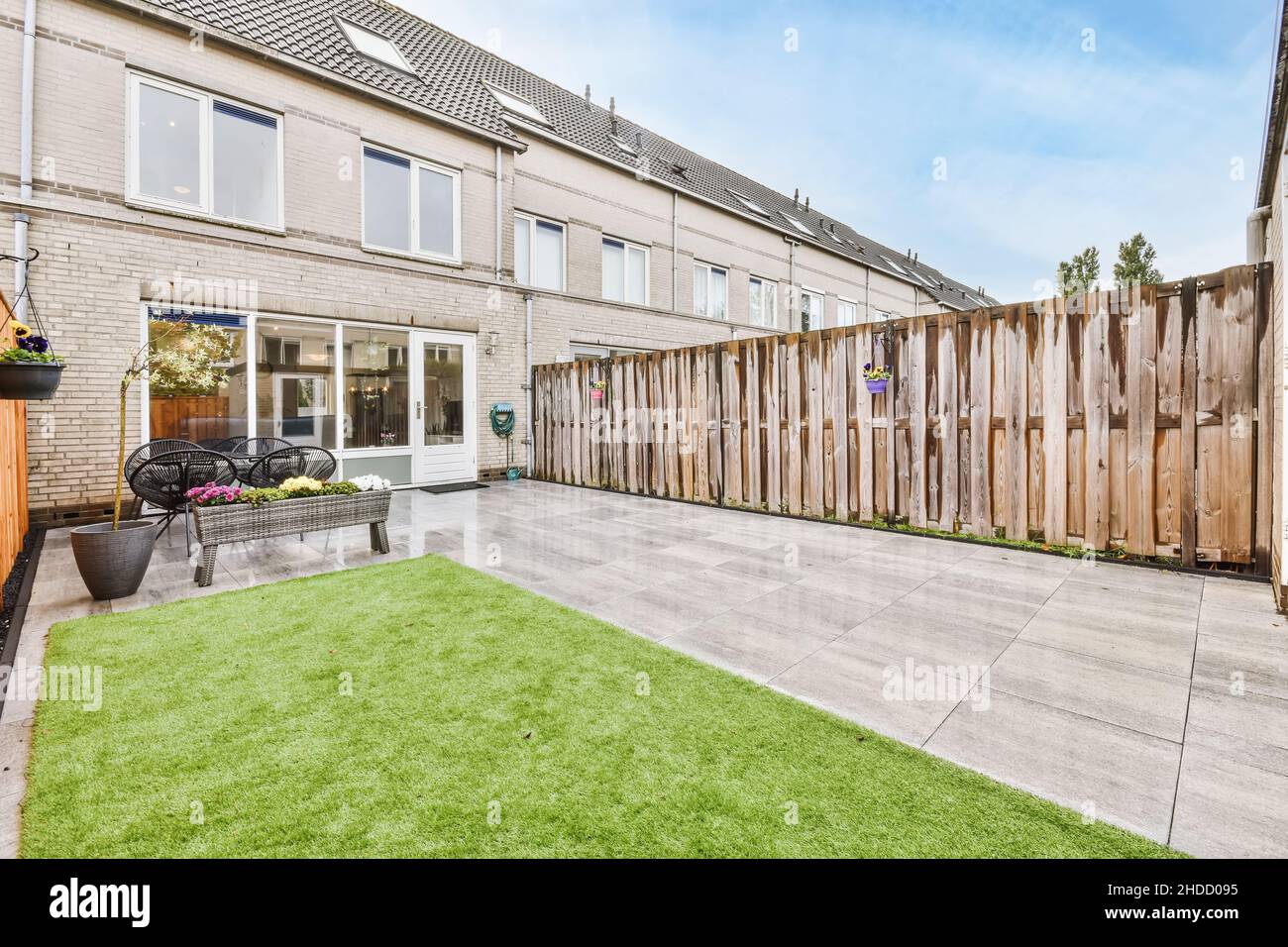 nice courtyard with greenery and a comfortable seating area Stock Photo ...