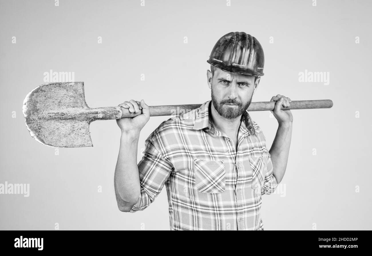 He loves his job. mature builder in shirt. unshaven man on construction ...