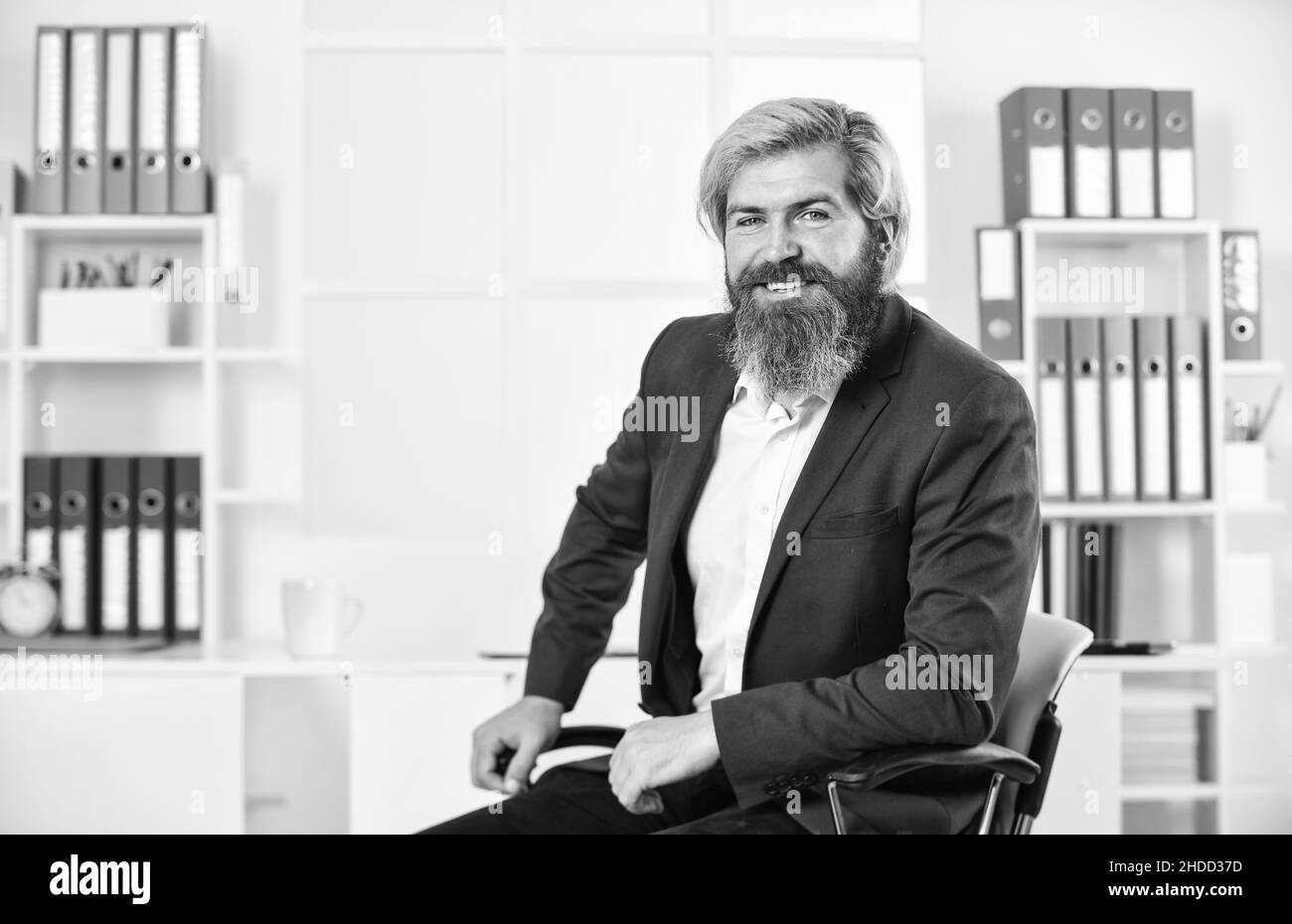 Management skills. Entrepreneur in modern office. Successful bearded ...