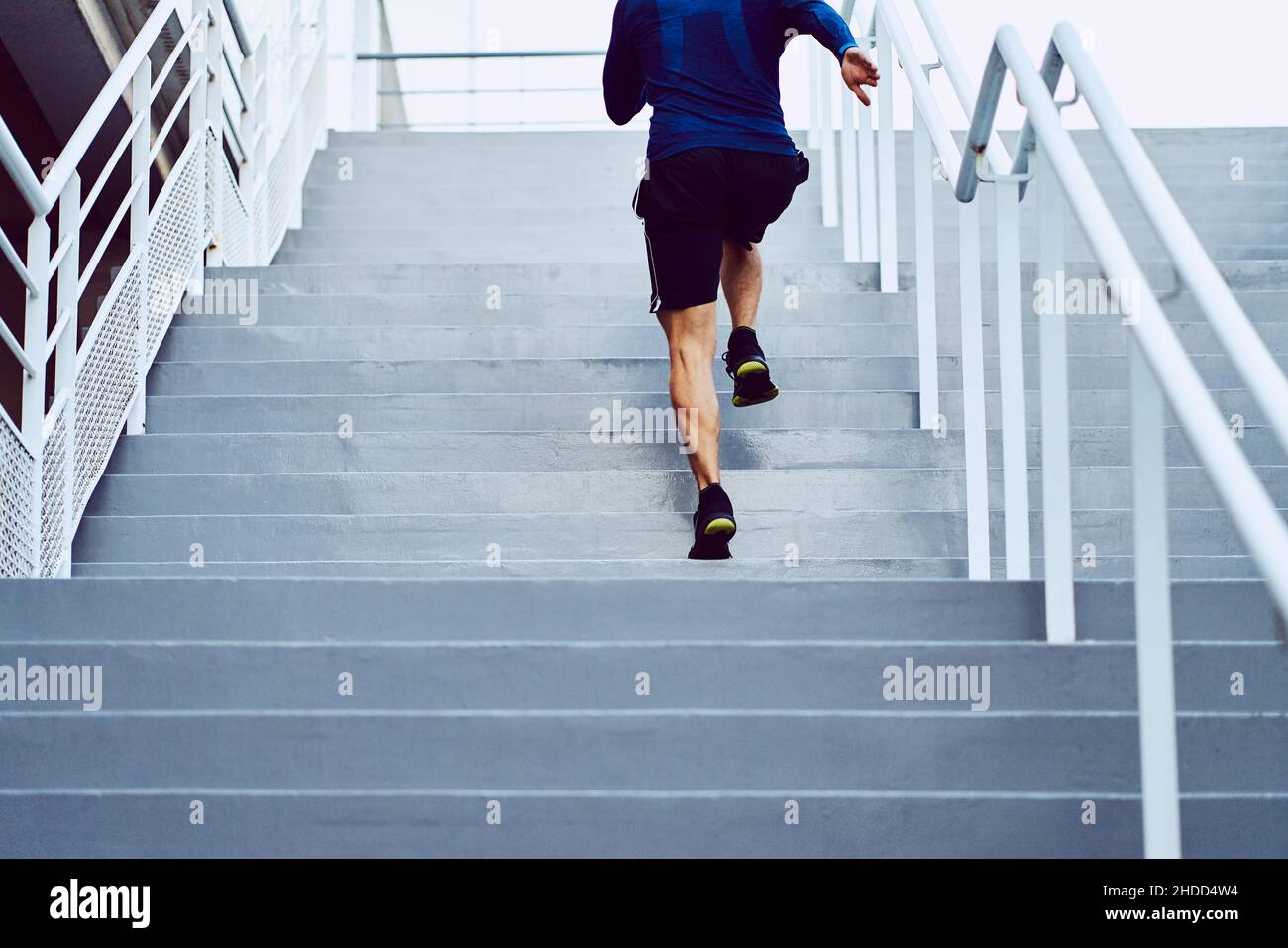 Fitness, health, and sport concept. Athletic man running upstairs Stock ...