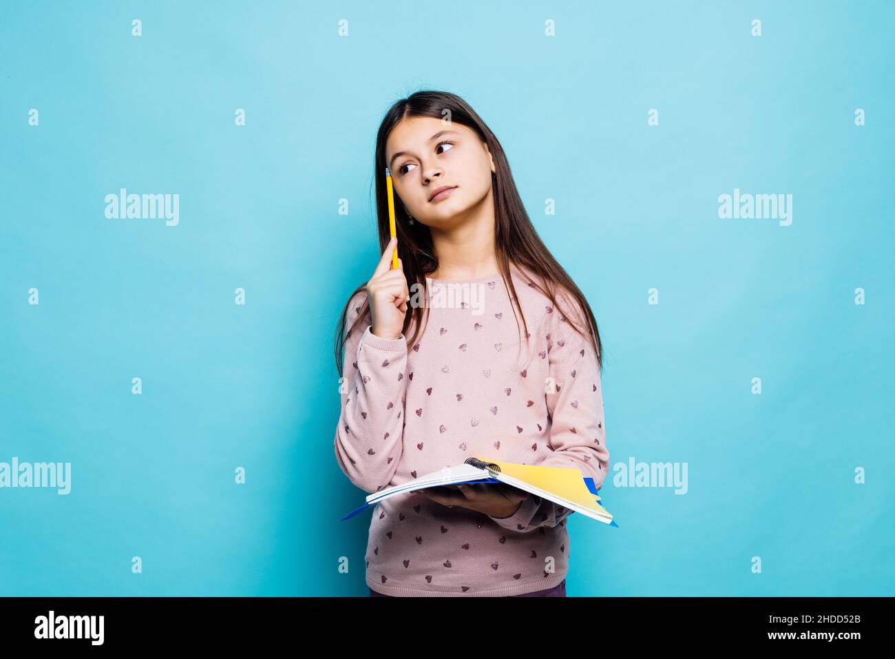 happy child making notes on blue background, childhood Stock Photo - Alamy