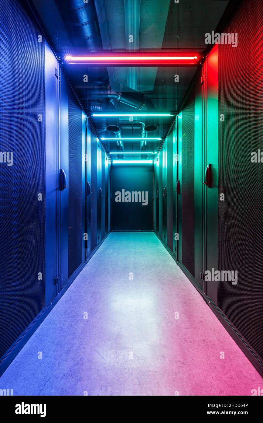 Cold aisle of an IT server room with perforated grille doors ...