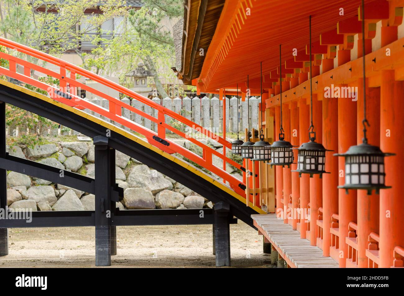 Lanterns and wooden bridge at the main temple of Itsukushima Shrine in ...