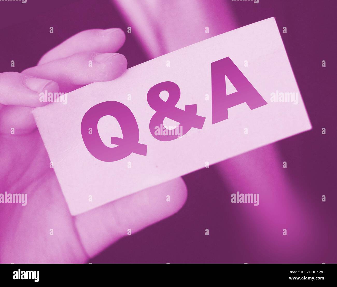 Q and A Questions and Answers sign on business card shown by a ...