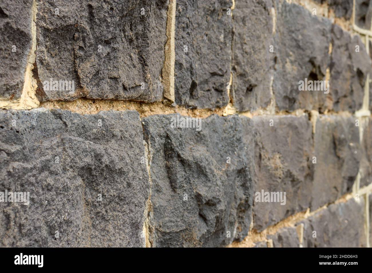 Closeup of an old chipped brick wall with cement lines in between Stock ...