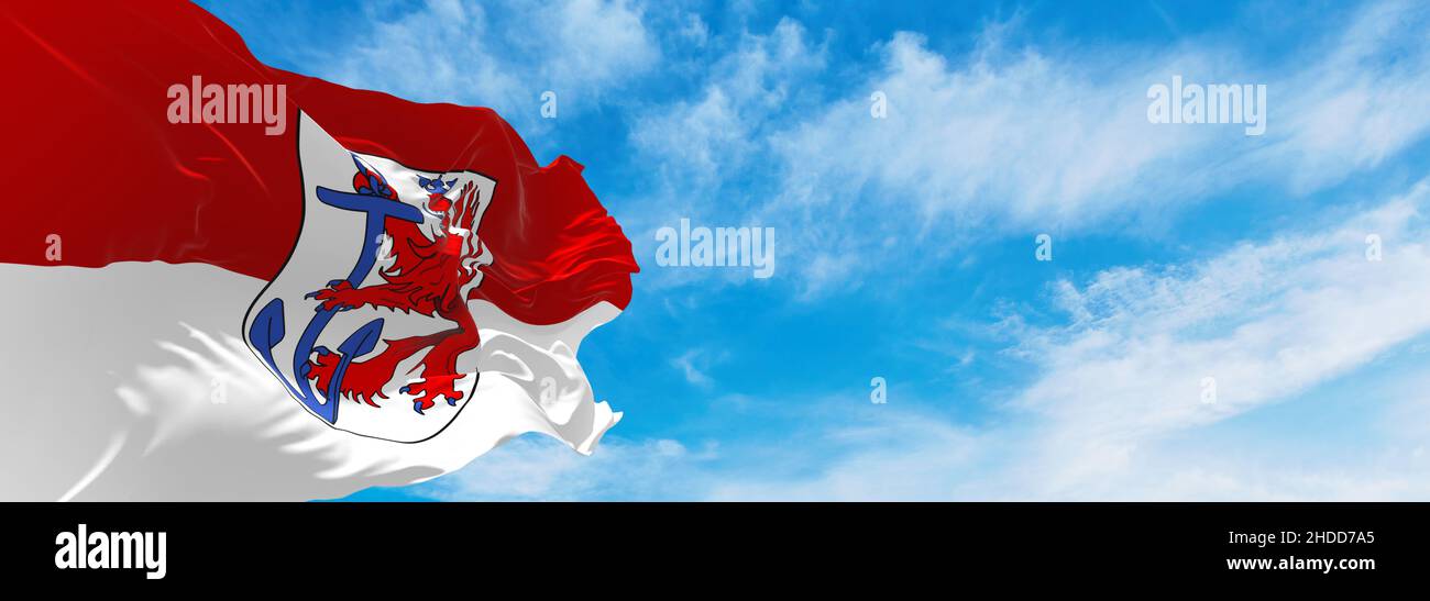 flag of Landeshauptstadt Duesseldorf at cloudy sky background on sunset ...