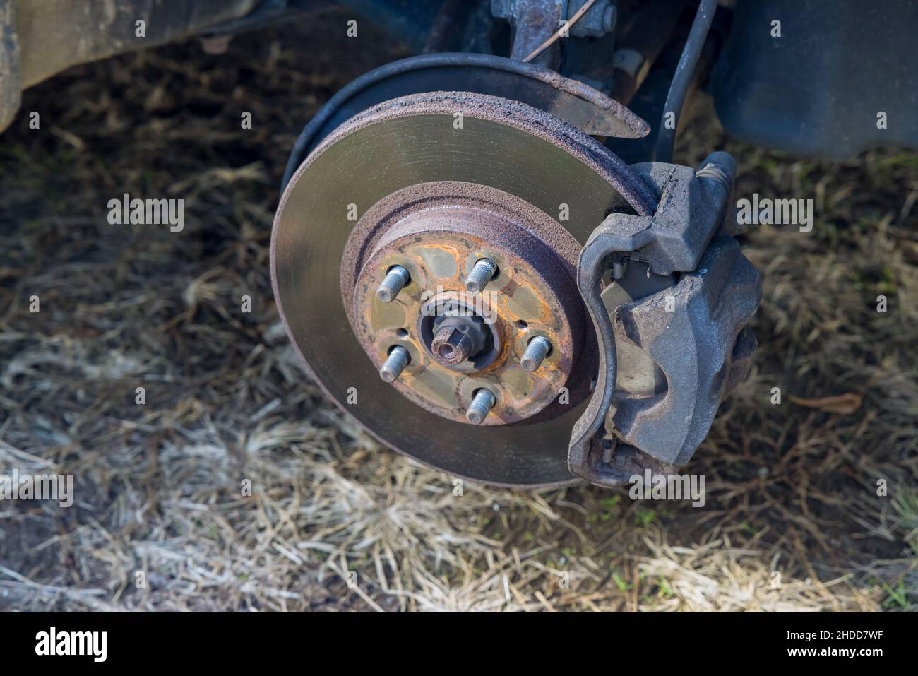 Auto mechanic repairing with change the old drive to the new brake disc ...