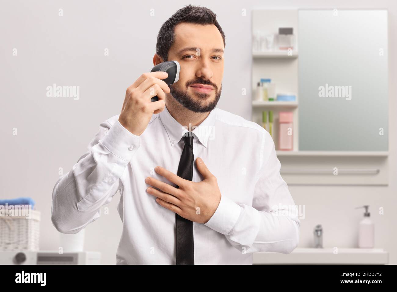Man shaving electric shaver in hi-res stock photography and images - Alamy