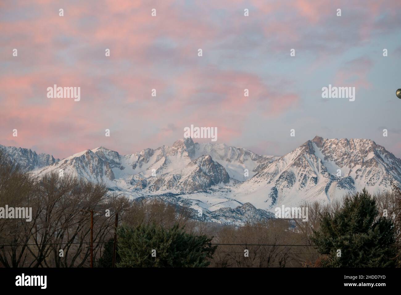 The Eastern Sierra peaks above Bishop, Inyo County, CA, USA light up ...