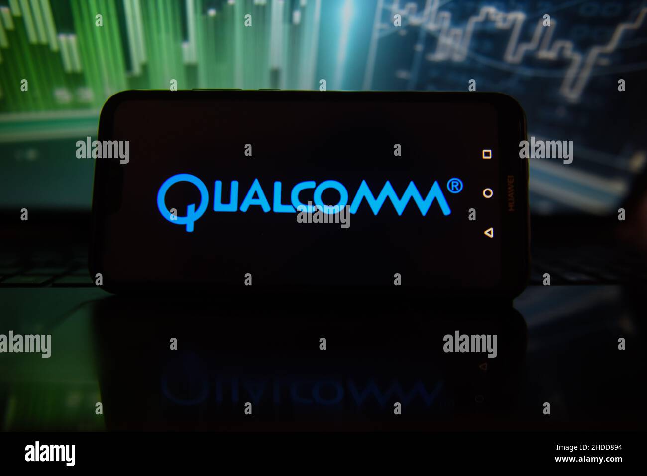In this photo illustration a Qualcomm logo is displayed on a smartphone ...
