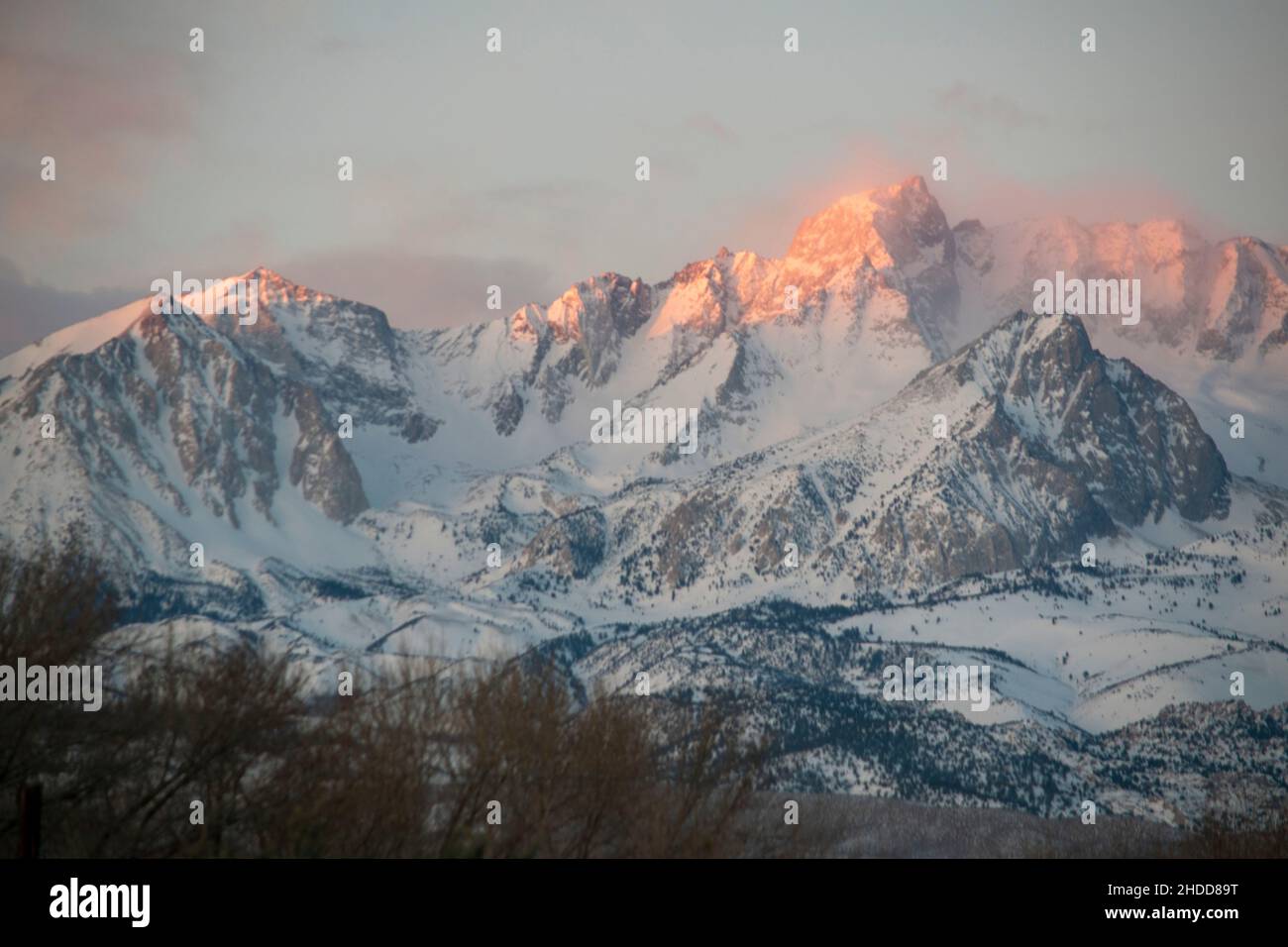 The Eastern Sierra peaks above Bishop, Inyo County, CA, USA light up ...