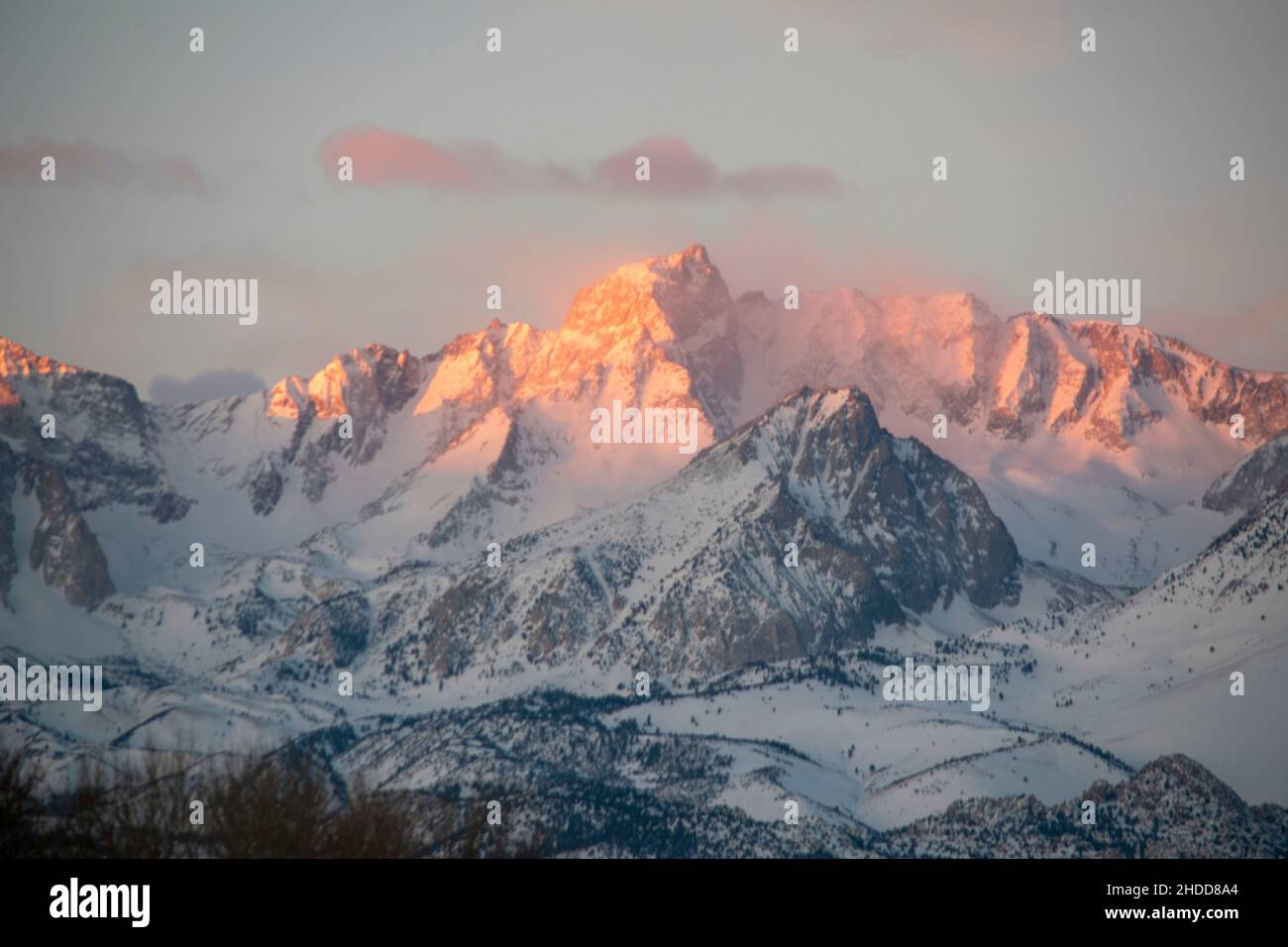 The Eastern Sierra peaks above Bishop, Inyo County, CA, USA light up ...