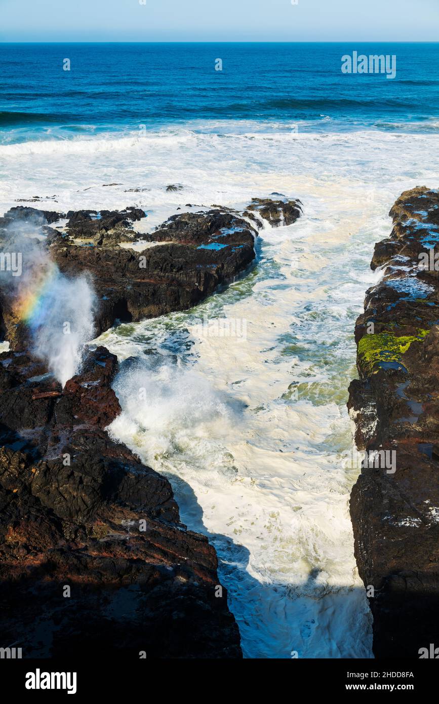 Prismatic rainbow in crashing waves; Devils Churn & Spouting Horn ...