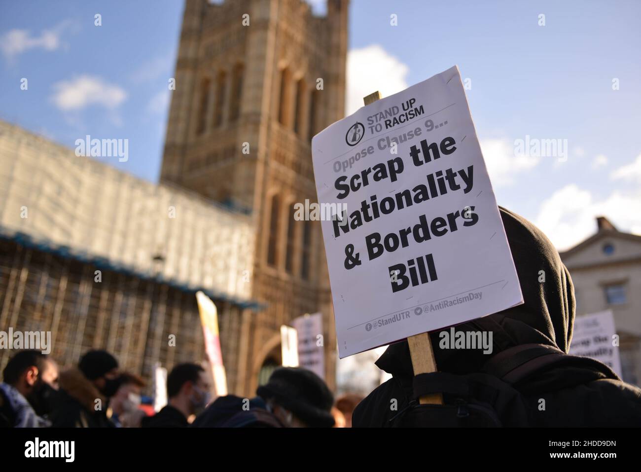 A protester holds a placard during the demonstration against the ...