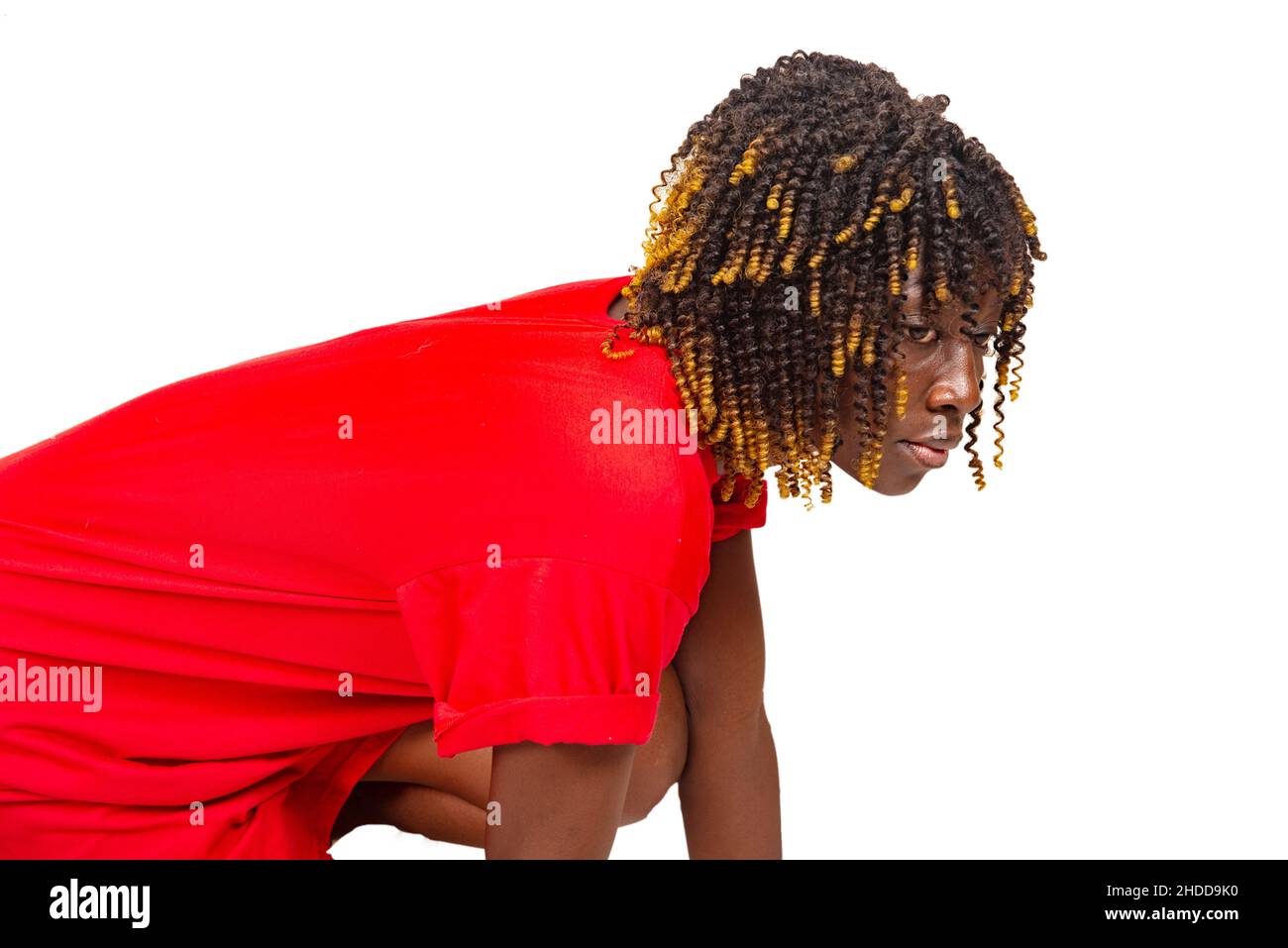 beautiful young woman wearing red clothes and sitting Stock Photo - Alamy
