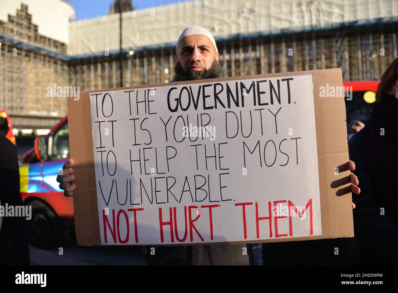A protester holds a placard expressing his opinion, during the ...