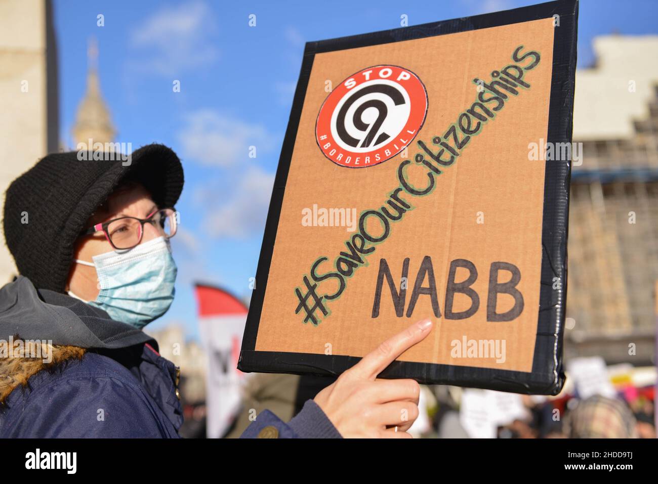 A protester holds a placard during the demonstration against the ...