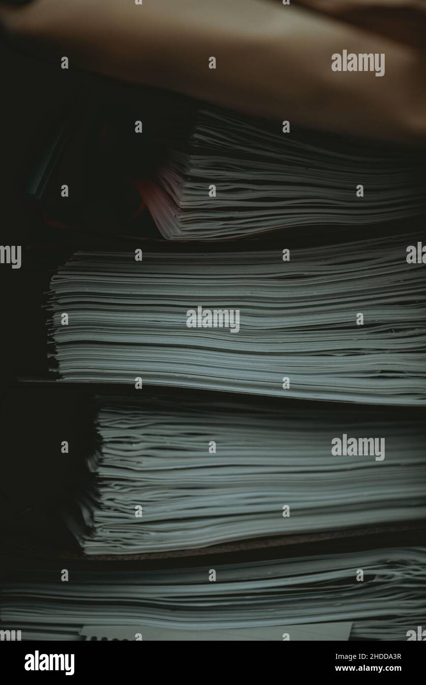 Vertical closeup shot of a large pile of paperwork Stock Photo - Alamy