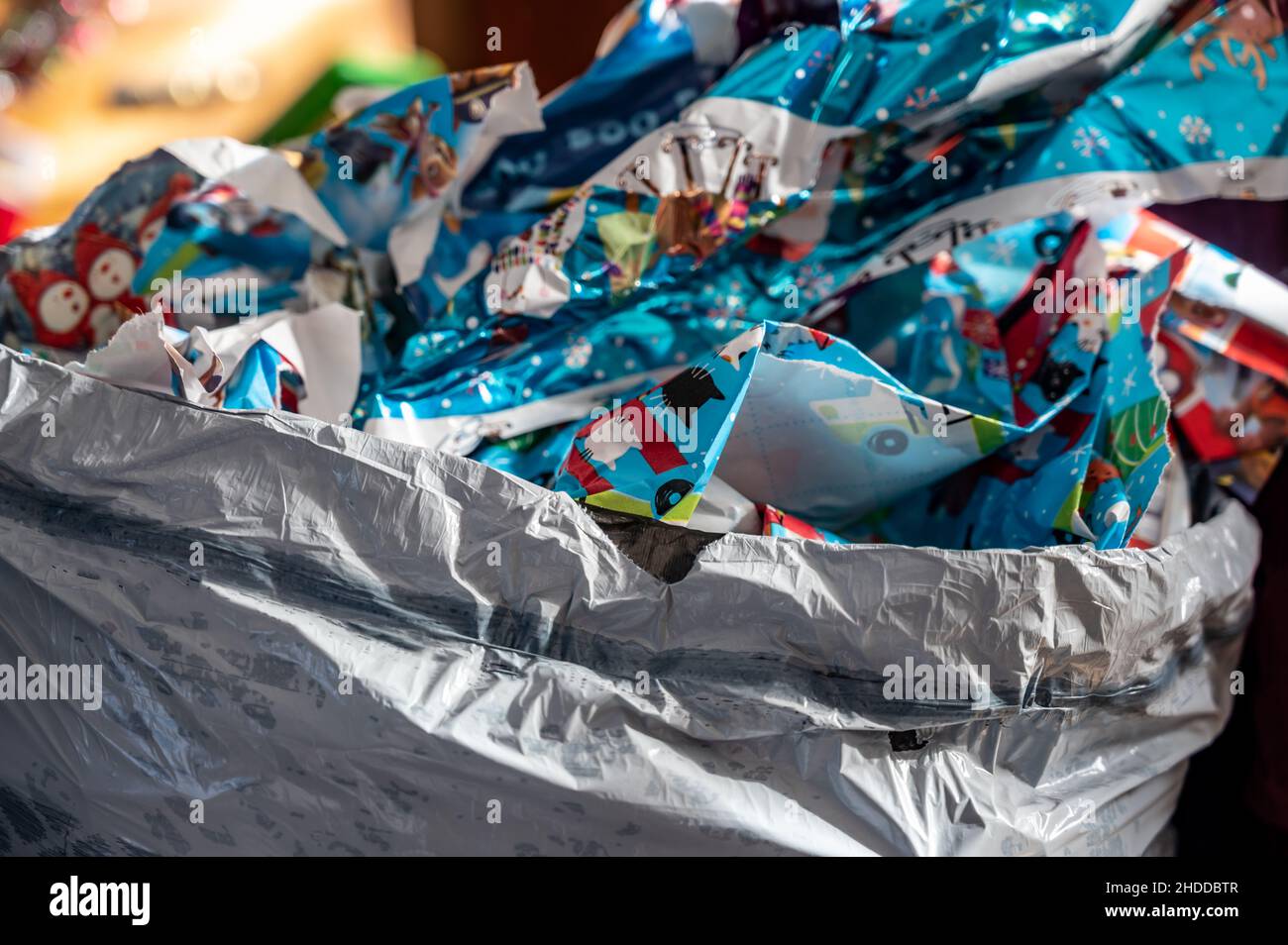 Discarded used wrapping paper in a trash bag after opening gifts Stock ...