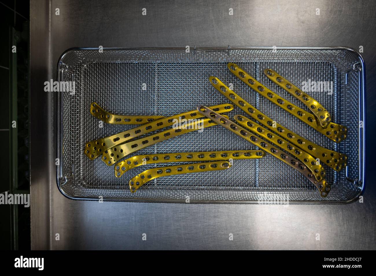 gold-colored titanium plates for the treatment of femoral fractures are ...
