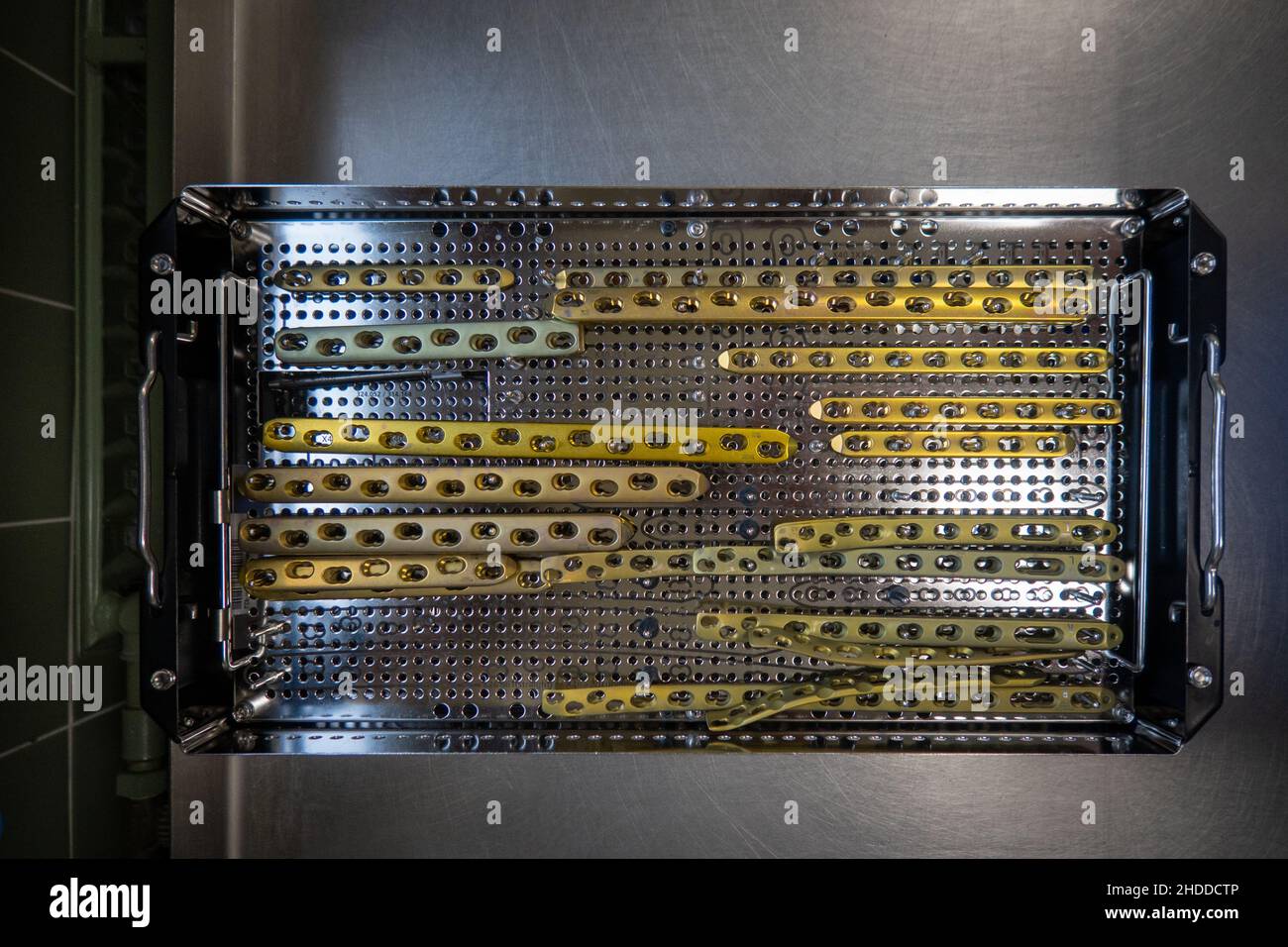 gold-colored titanium plates for the treatment of femoral fractures are ...