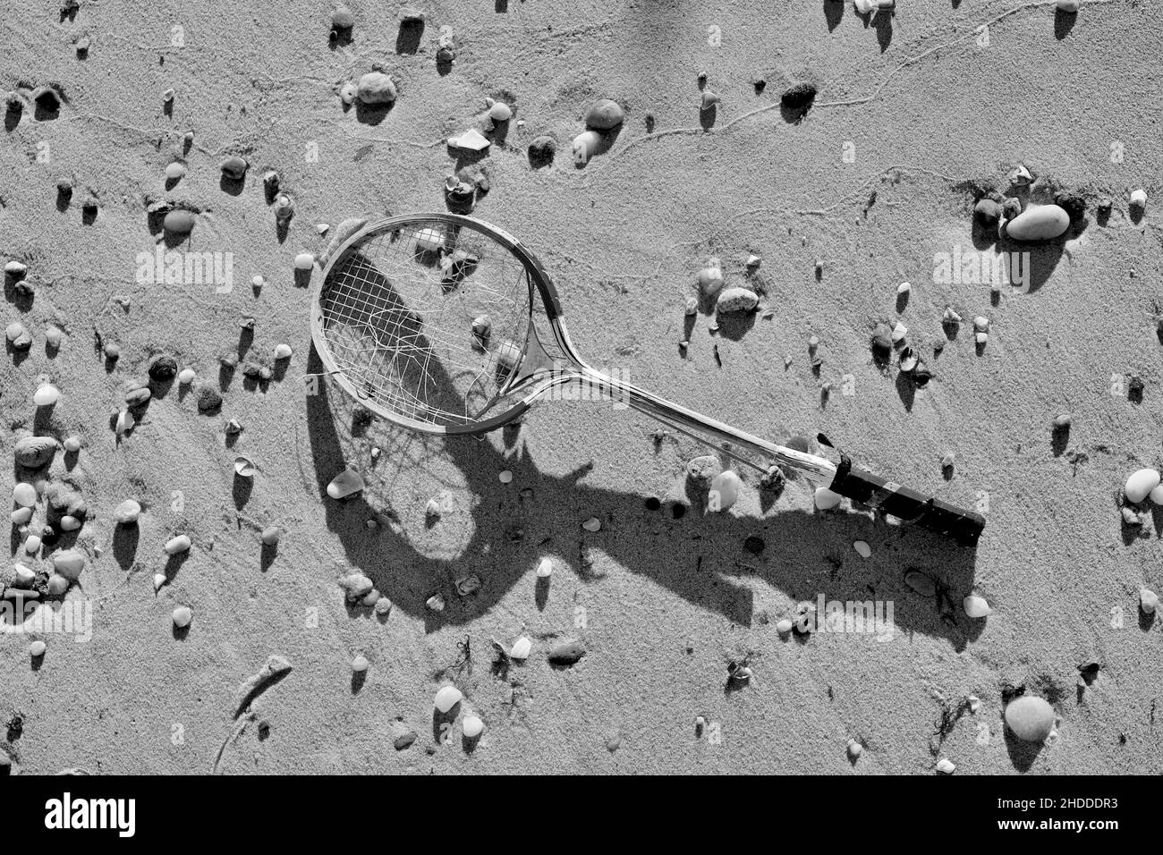 Old Broken Badminton racket washes up on beach sand Stock Photo - Alamy