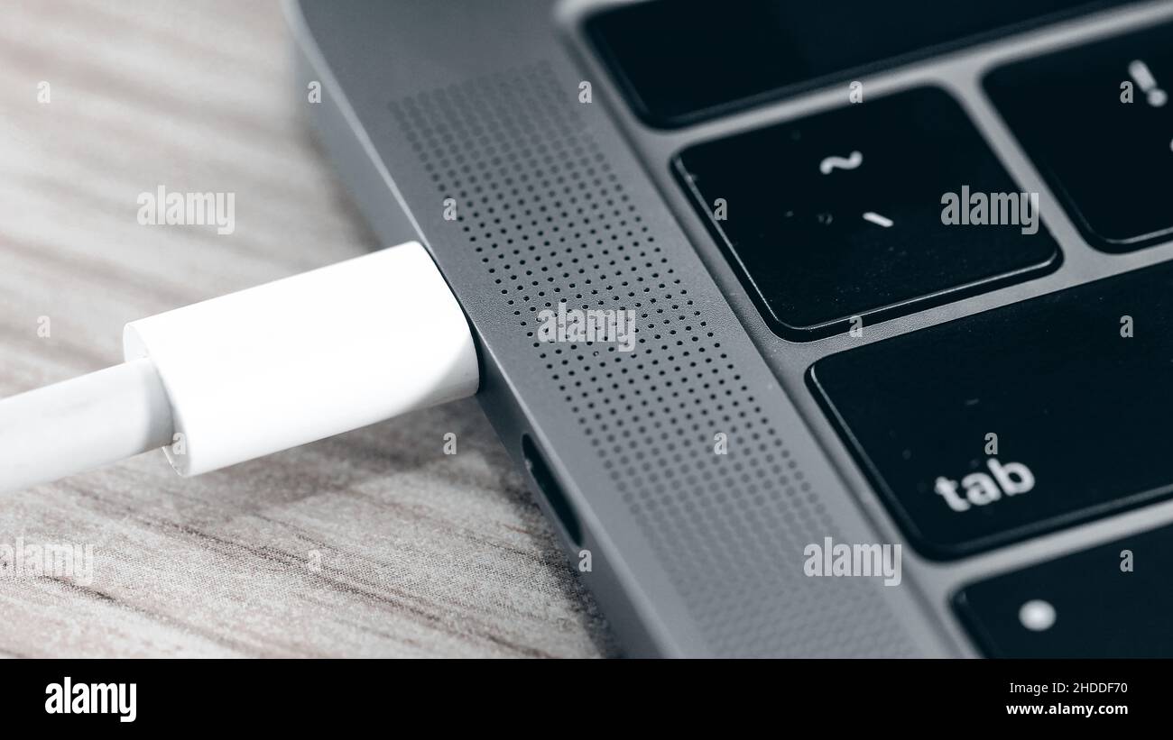 notebook power and data cable connection Stock Photo - Alamy