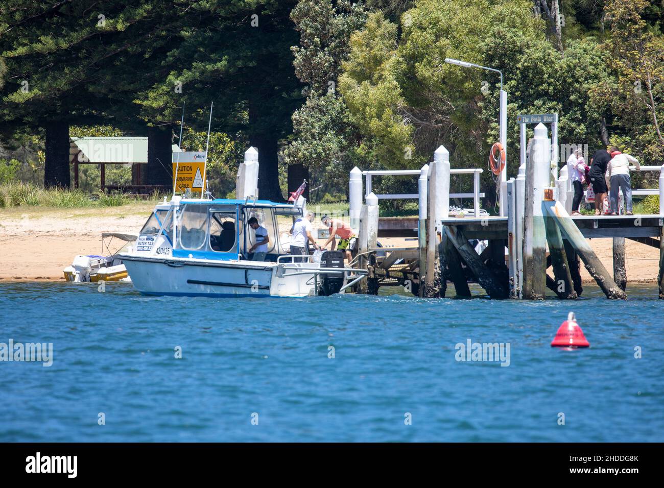 Water taxi boat dropping campers off at the Basin wharf campground in ...