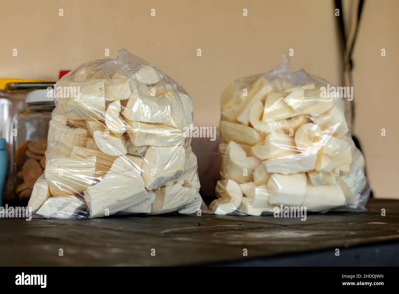 Plastic bags with pieces of peeled and washed cassava Stock Photo - Alamy