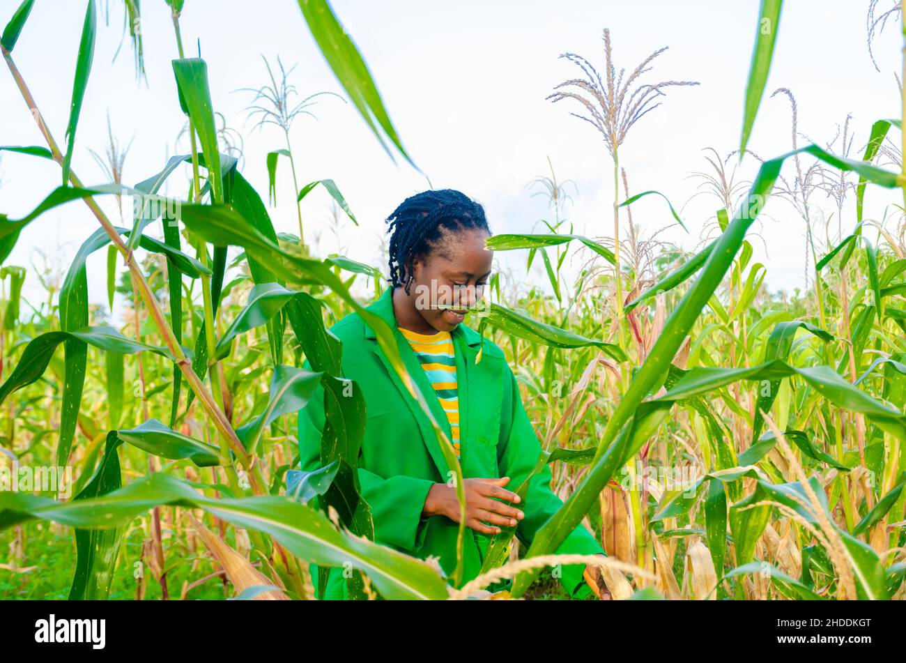 pretty agriculturist smiles as working on her crops Stock Photo - Alamy