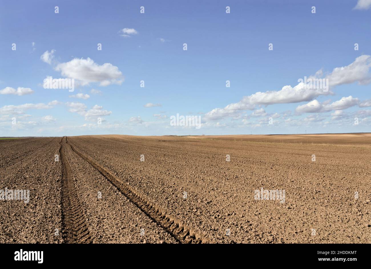 Ploughed farm and tractor tyre prints Stock Photo - Alamy