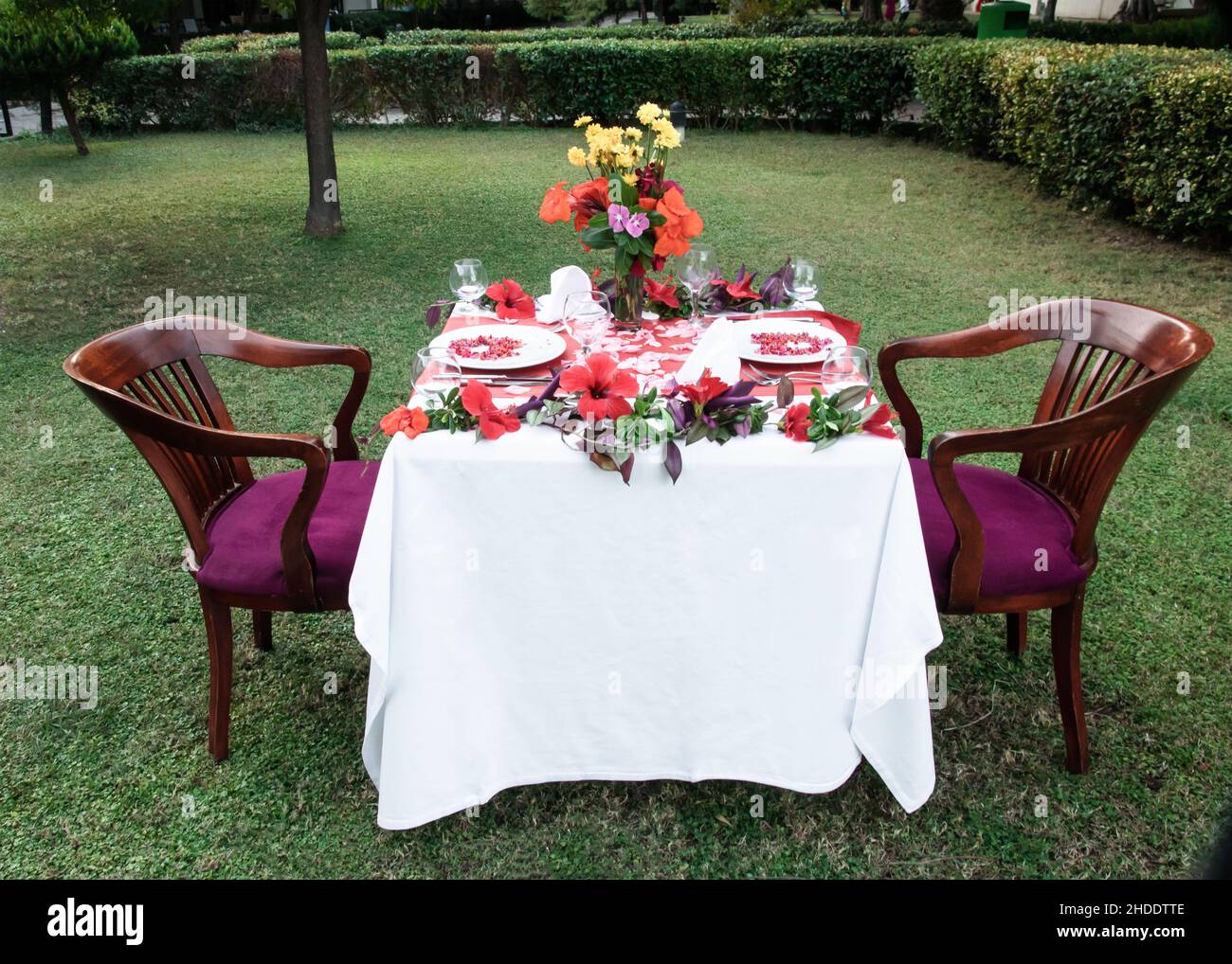 A table decorated with flowers with beautiful dishes, for a date and a ...