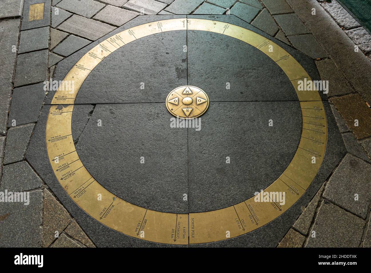 Closeup of a circular design on the pavement with a gold ring around ...