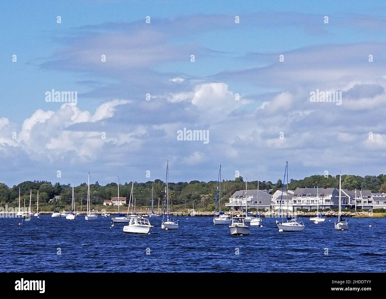 Sailboats docked in a marina in Bristol Harbor, Rhode Island, on a ...