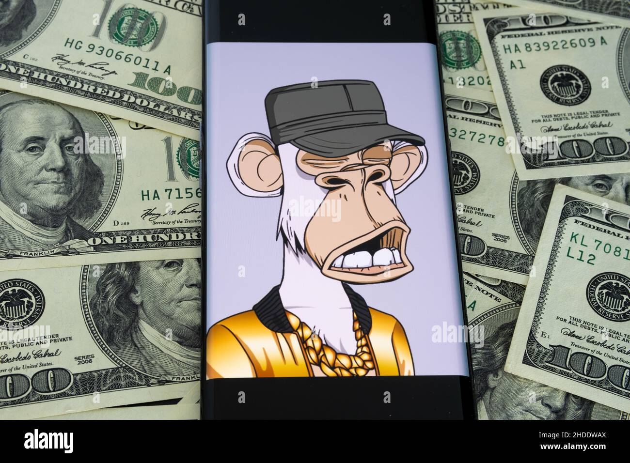Bored Ape Yacht Club #9055 NFT seen on smartphone placed on dollars ...