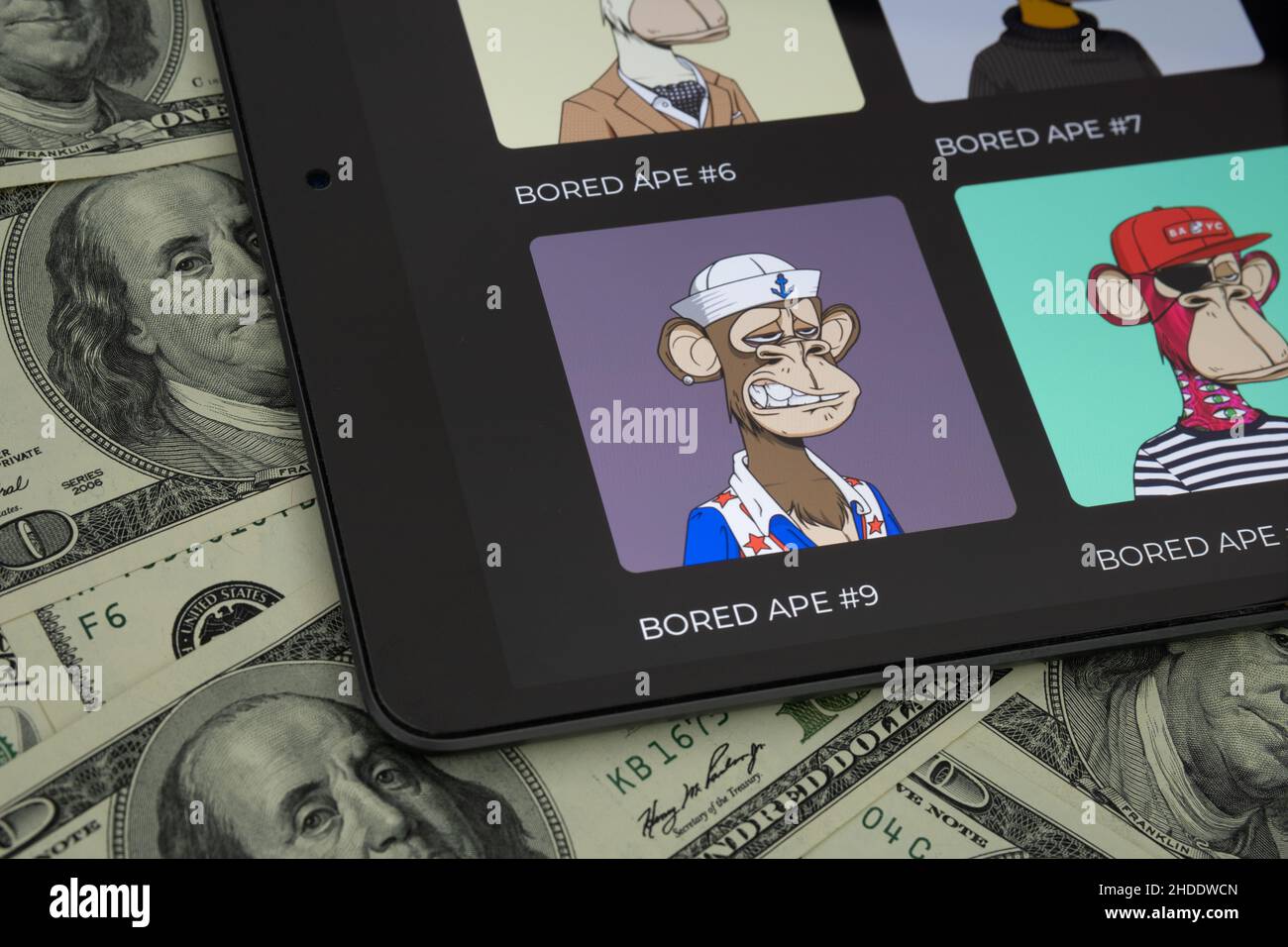 BORED APE NFT digital art collection seen on tablet screen placed on ...