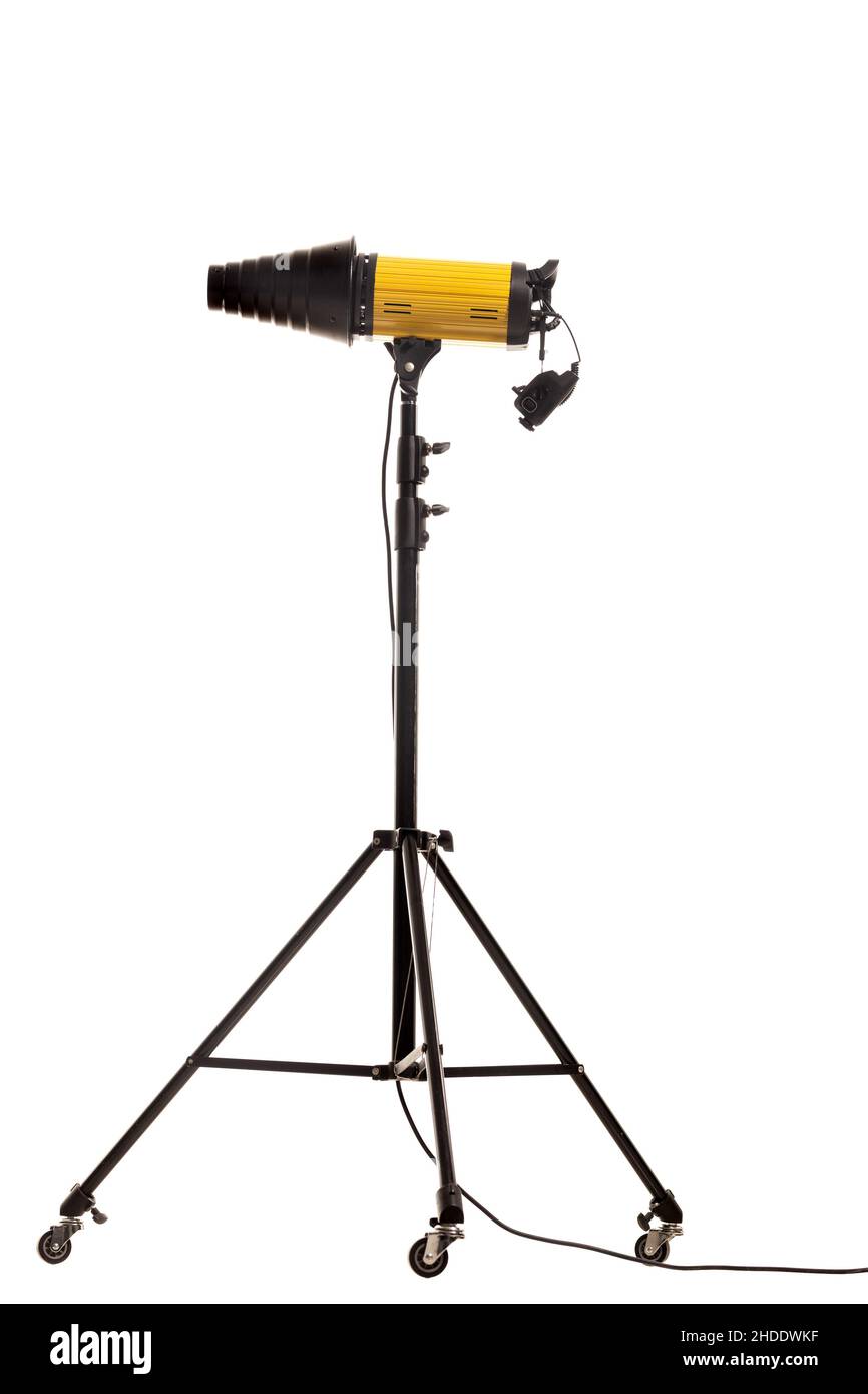 Flash strobe with snoot light modificator on stand with wheels. Studio ...