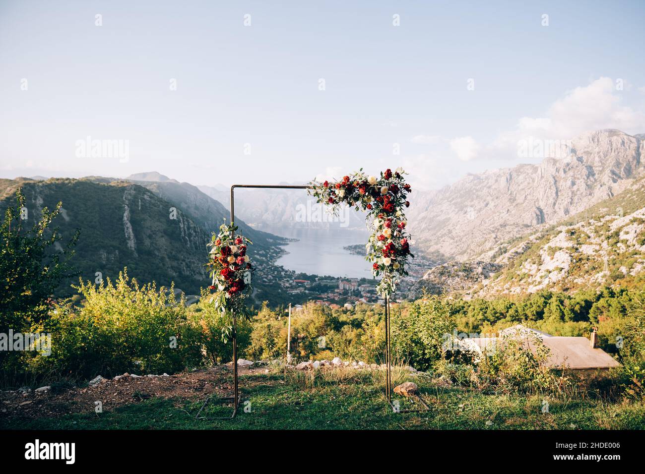 Wedding arch decorated with flowers and green leaves hi-res stock ...