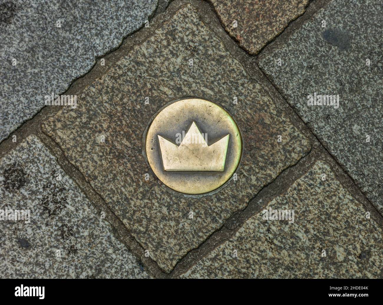 Top view of a gold crown design in the pavement Stock Photo - Alamy