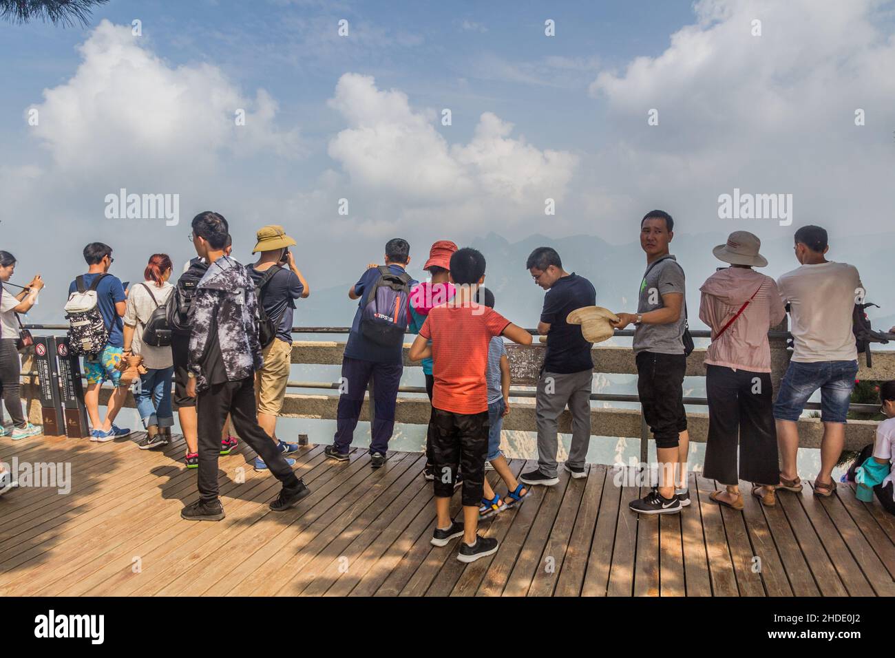 HUA SHAN, CHINA - AUGUST 4, 2018: People at a viewpoint at Hua Shan ... HUA SHAN, CHINA - AUGUST 4, 2018: People at a viewpoint at Hua Shan ...