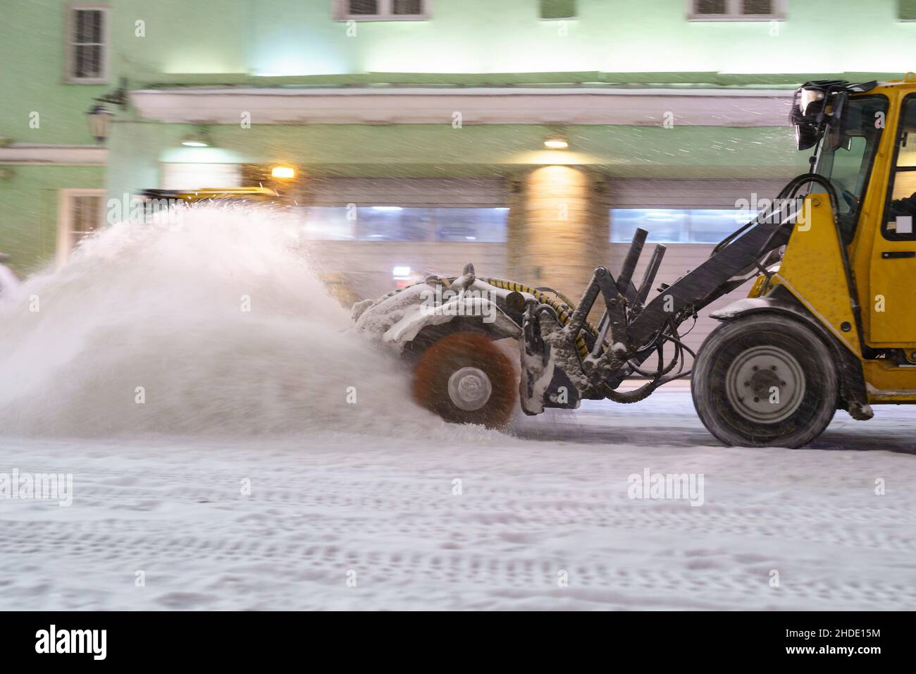 Snow Plow clearing road at night, municipal services cleaning city ...