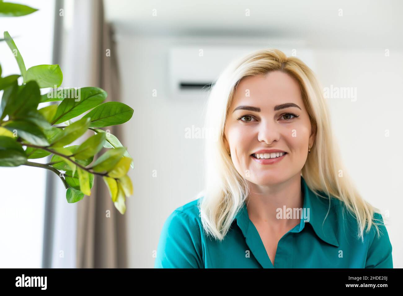 Pretty happy businesswoman looking at camera, head shot portrait of ...