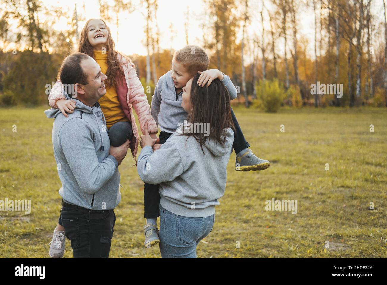 Portrait four happy family members hi-res stock photography and images ...