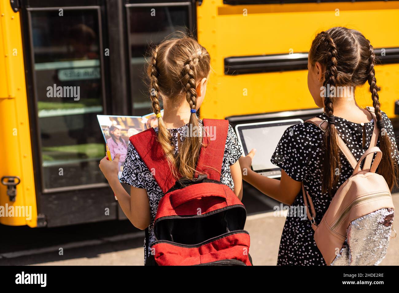 Education: Smiling Student Friends Ready For School next to school bus ...
