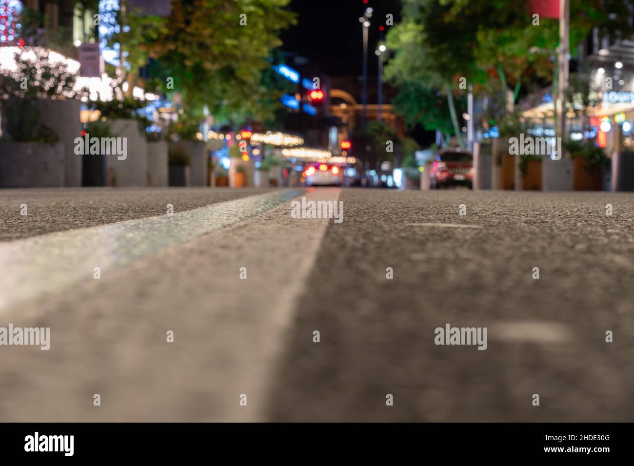 Defocussed city street at night with blurred lights and colors from ...