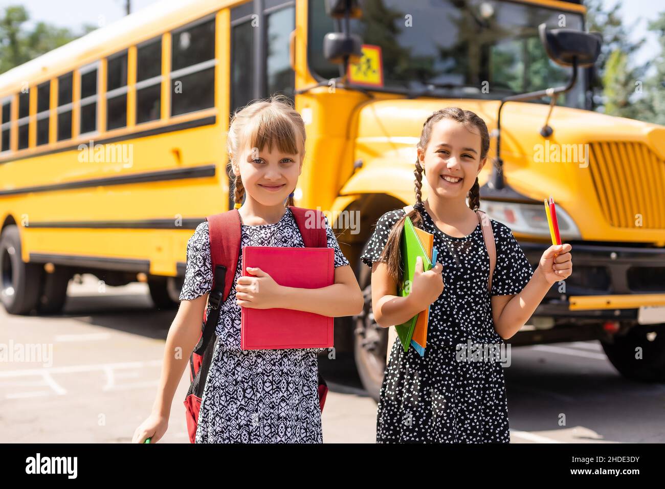 Basic school students crossing the road Stock Photo - Alamy