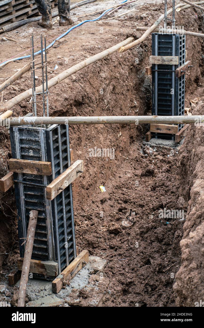 Cement concrete poll in construction site wall building new house ...